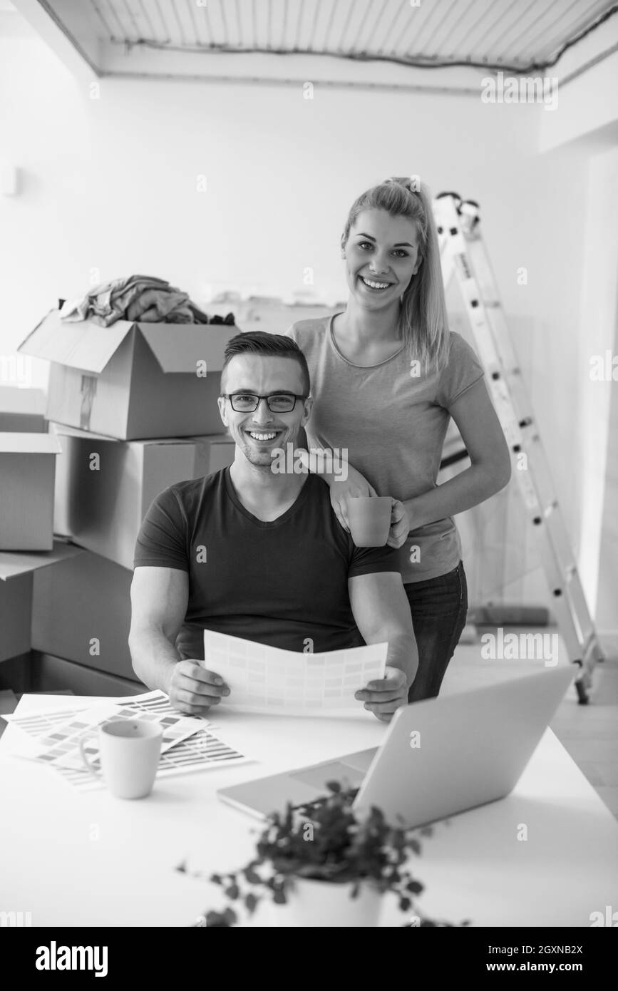 Happy man packing boxes Black and White Stock Photos & Images - Alamy