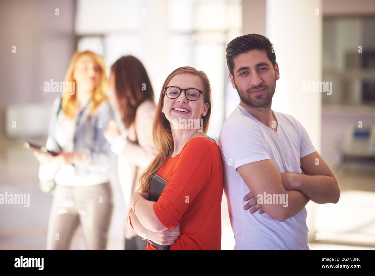 happy students couple standing together at university campus interior ...