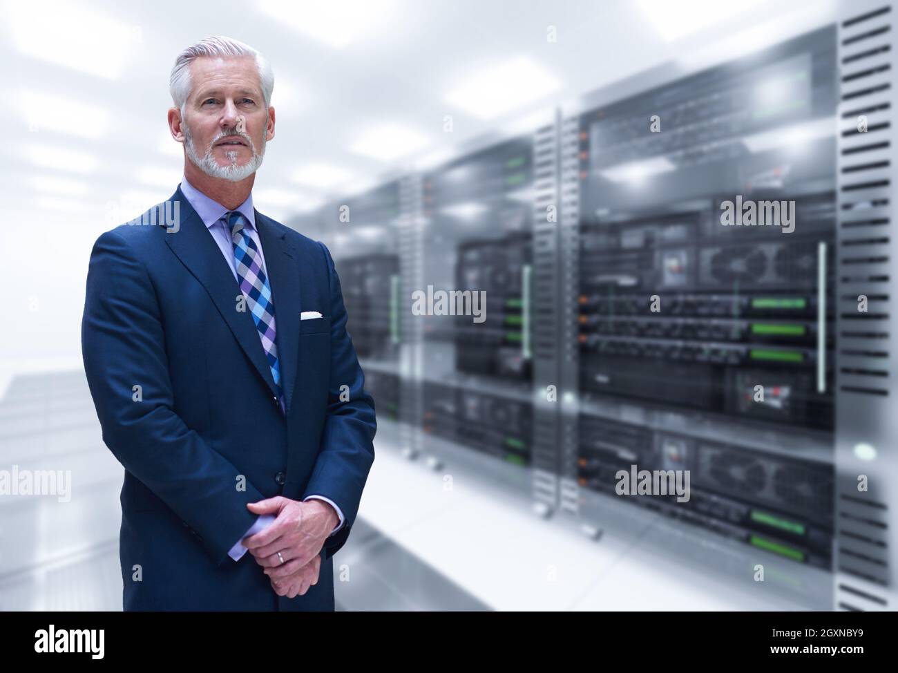 Portrait of senior businessman in big rack server room Stock Photo - Alamy