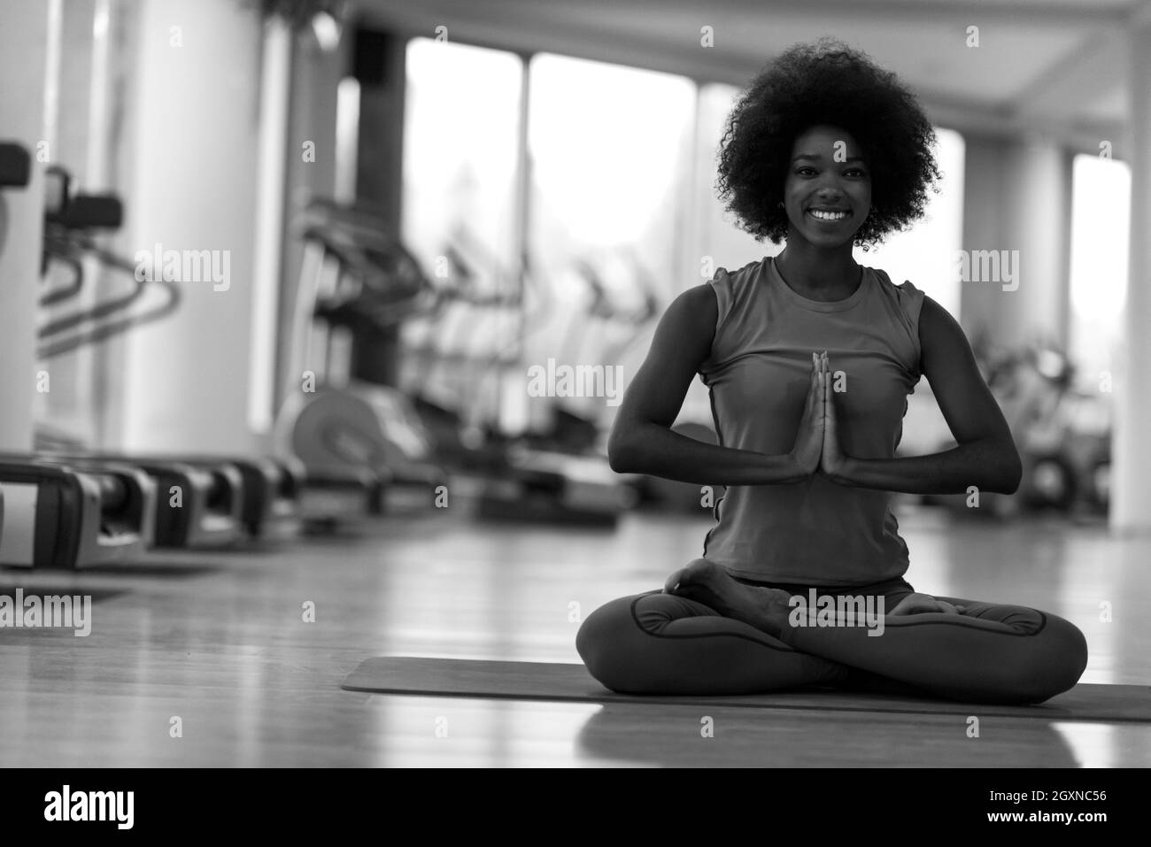 beautiful young african american woman exercise yoga in gym Stock Photo ...