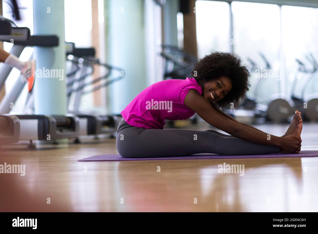 beautiful young african american woman exercise yoga in gym Stock Photo ...