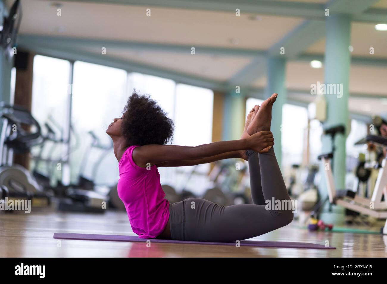 beautiful young african american woman exercise yoga in gym Stock Photo ...
