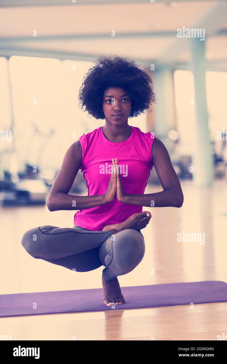 beautiful young african american woman exercise yoga in gym Stock Photo ...