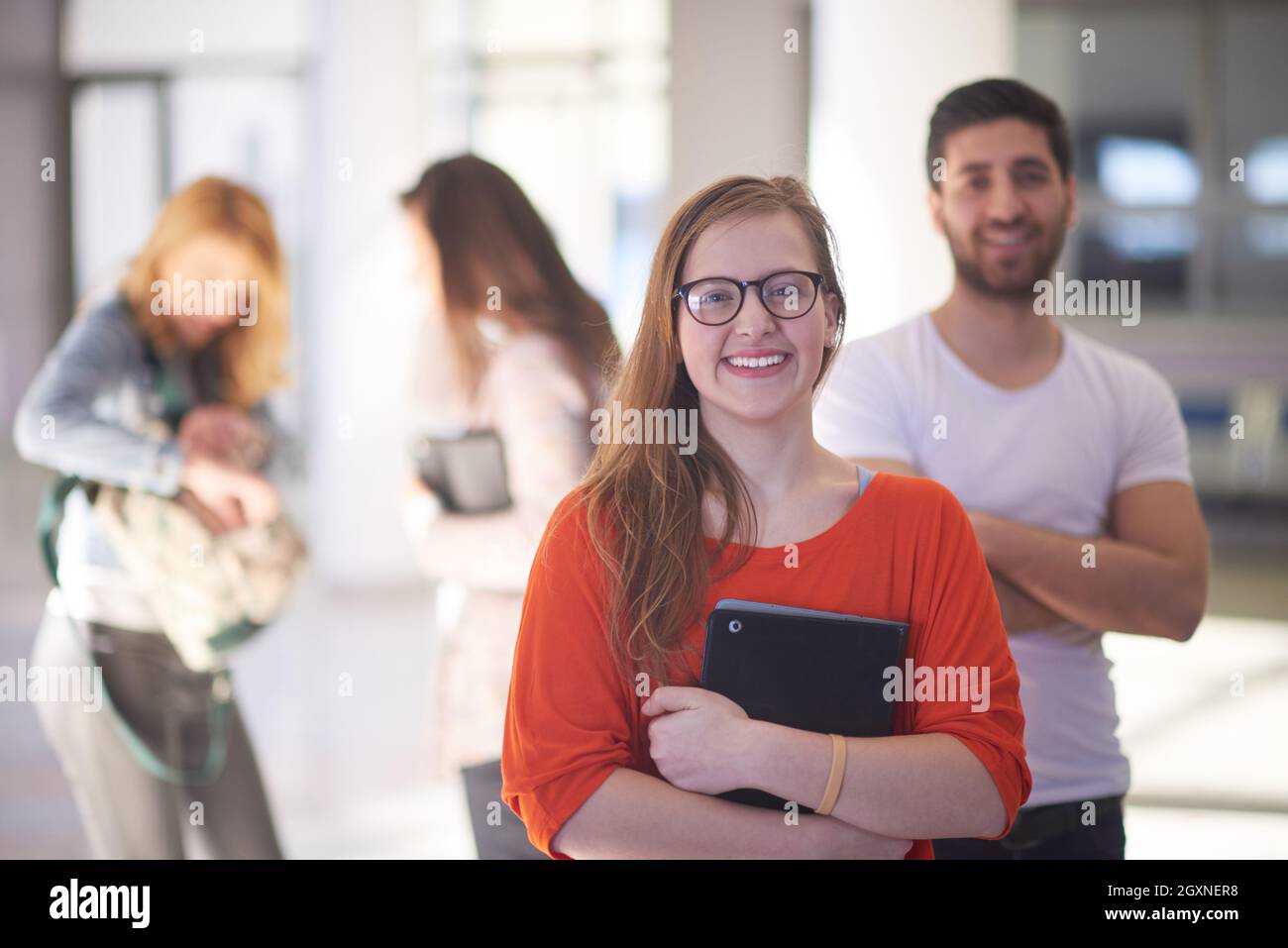 happy students couple standing together at university campus interior ...
