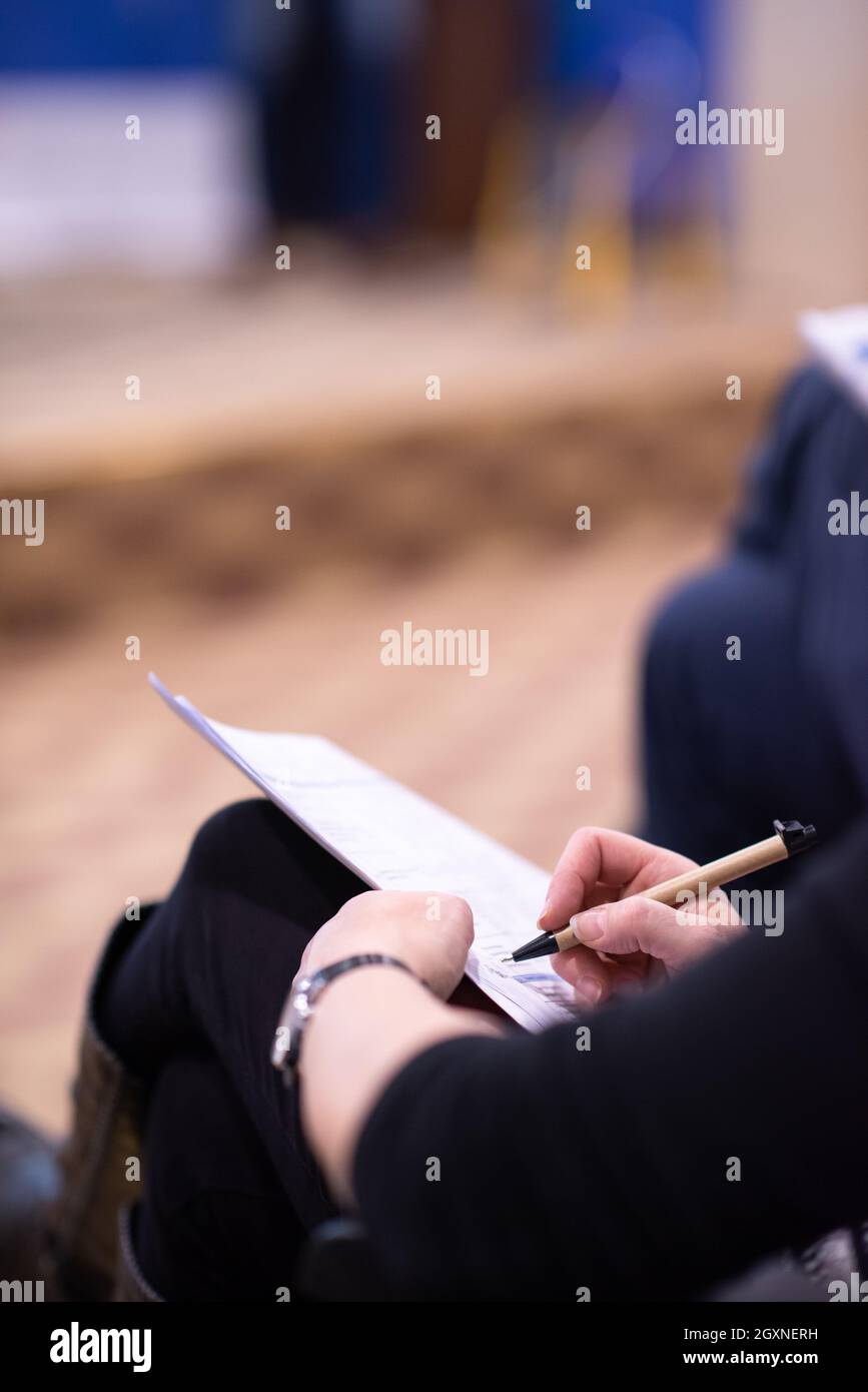 young people taking notes on education training business seminar at ...