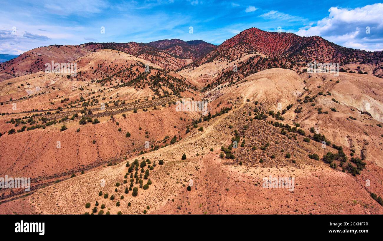 Mountains with colorful layers of yellow to red sand Stock Photo - Alamy