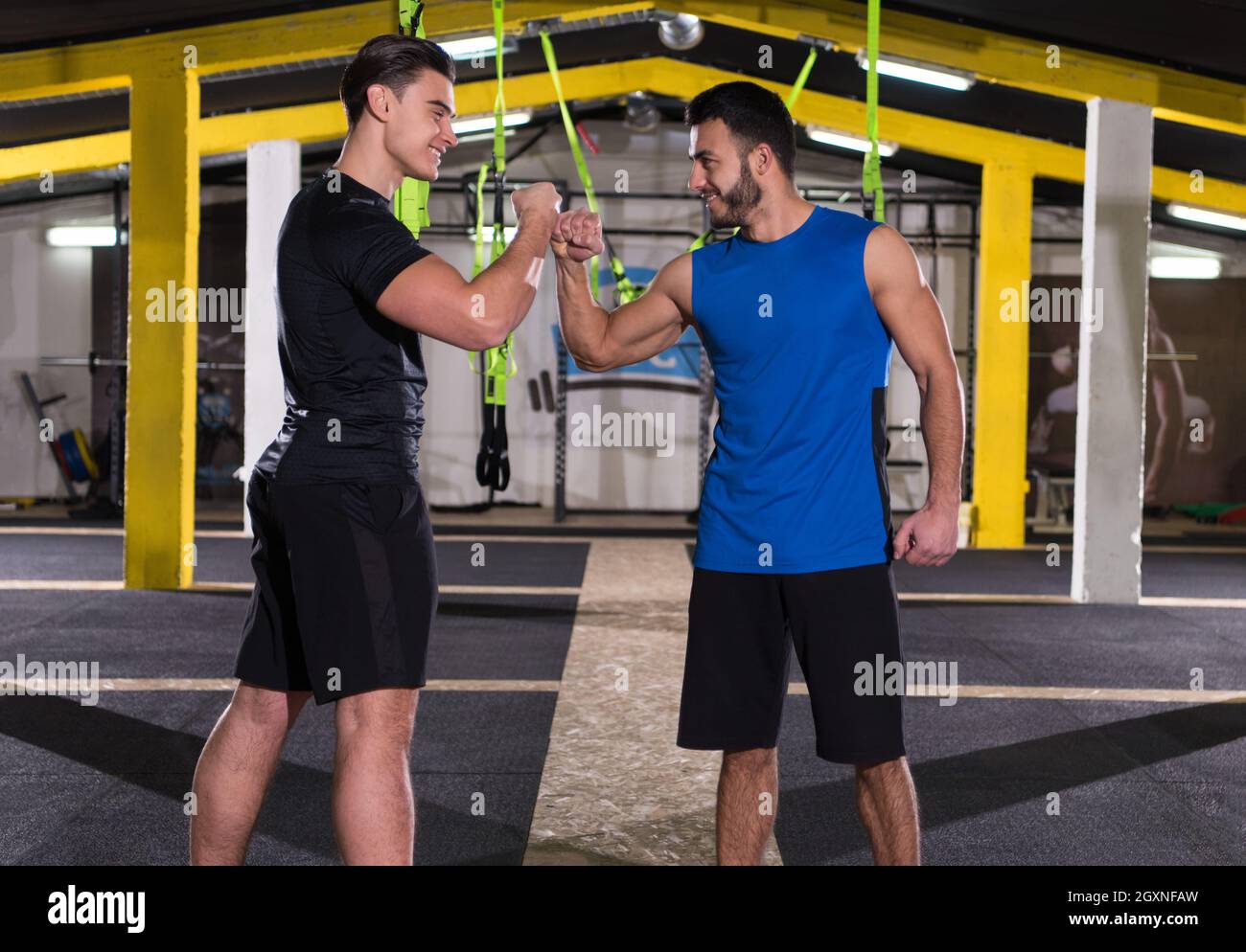 a young men athletes making high five after hard exercise at cross ...