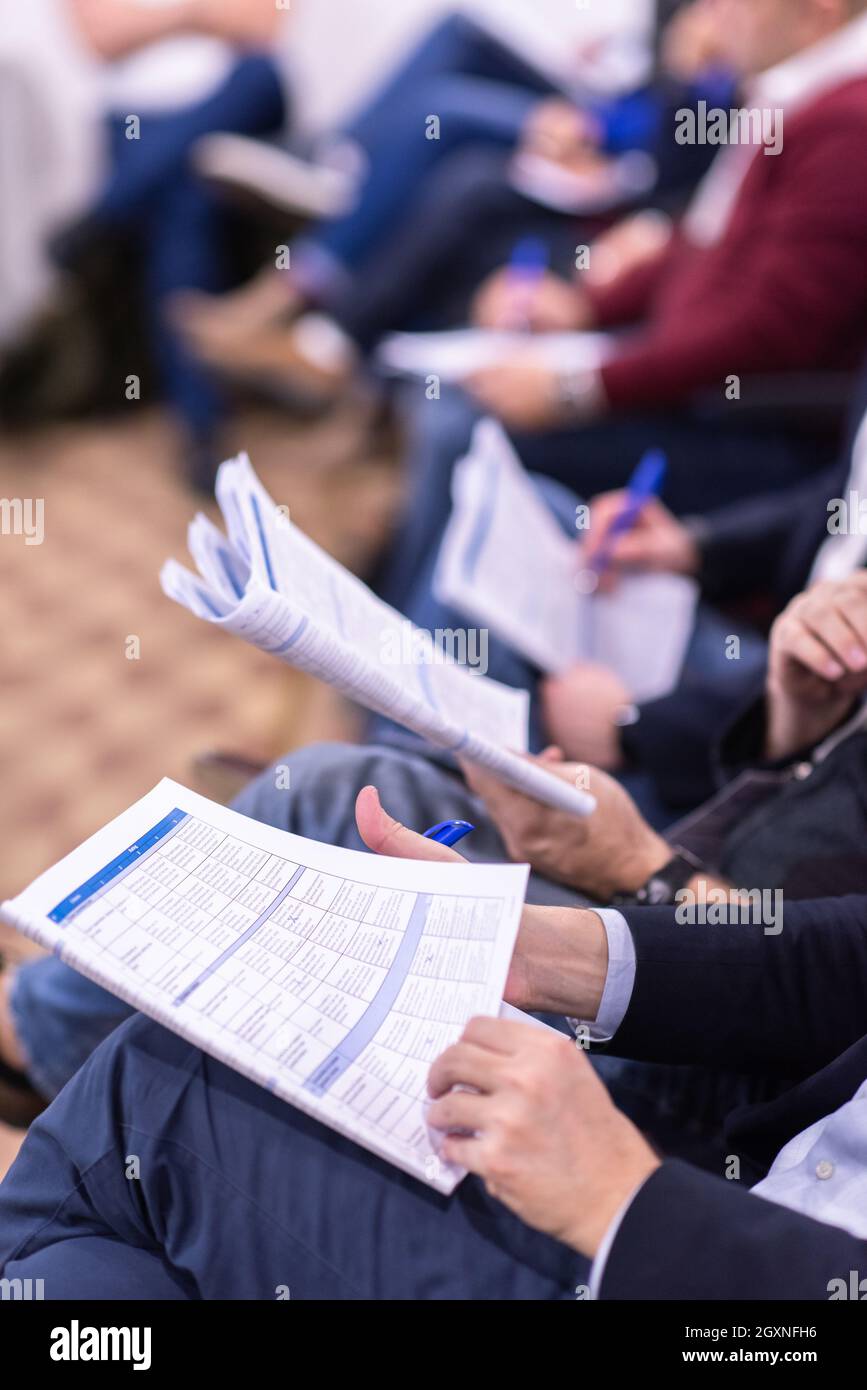 young people taking notes on education training business seminar at ...