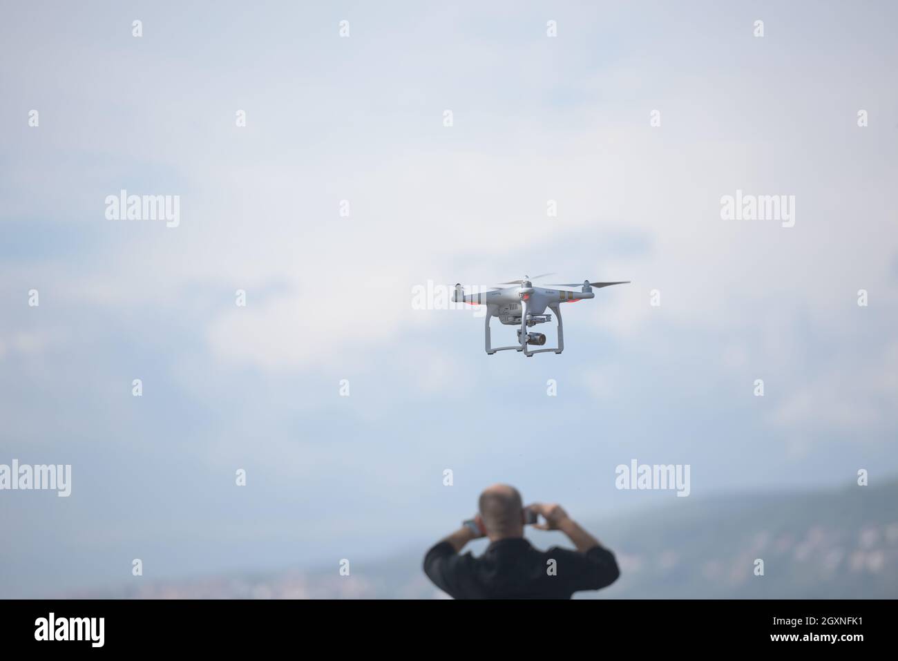 drone remote control with cellphone preview Stock Photo - Alamy
