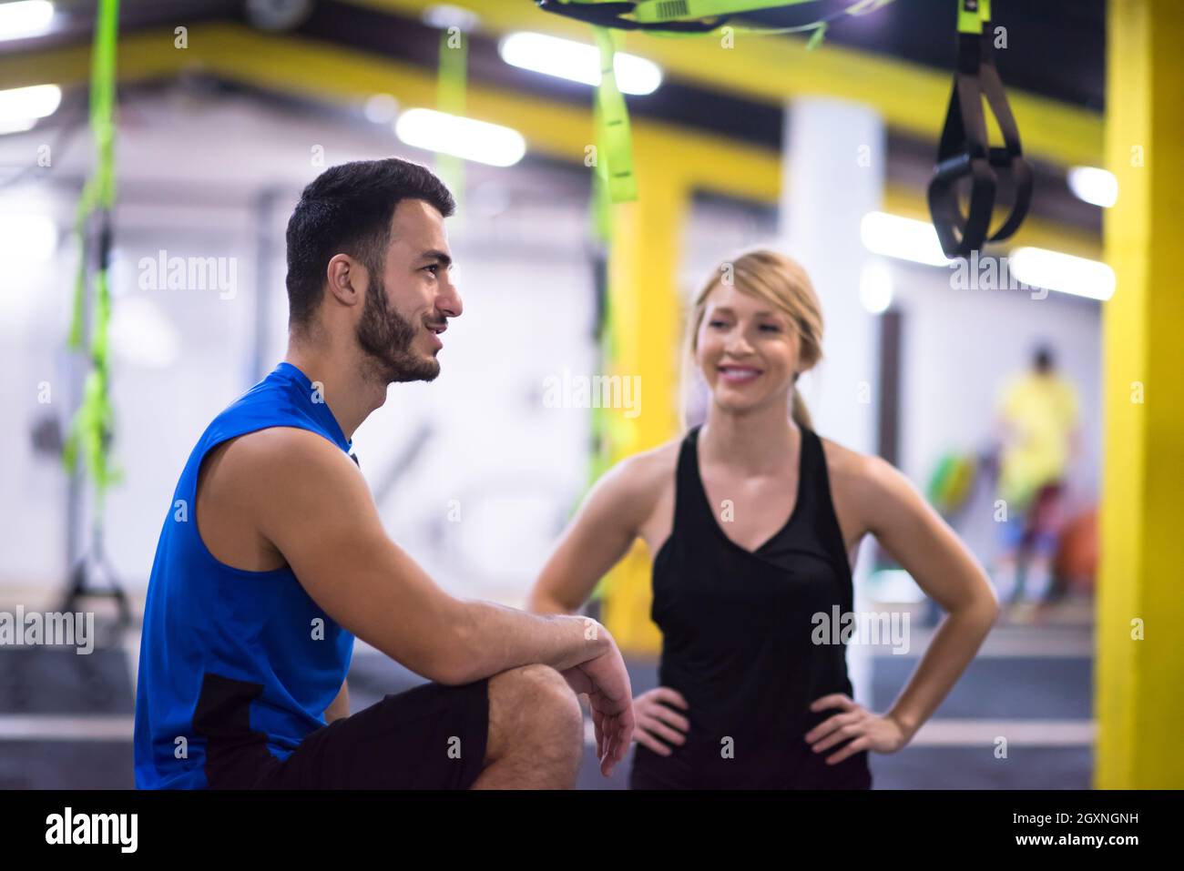 group of young healthy athletic people training jumping on fit box at ...