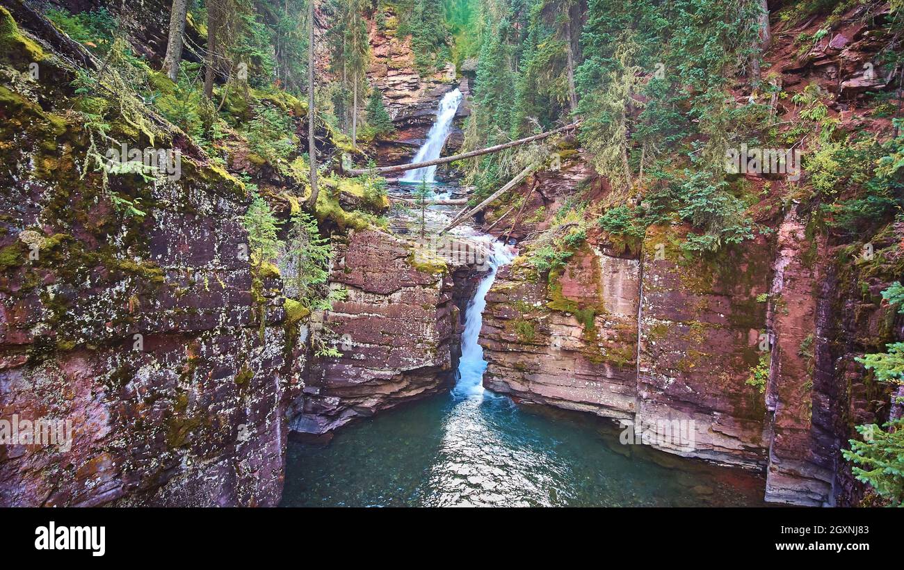 Lichen rocks lining canyon with river cutting through center Stock ...