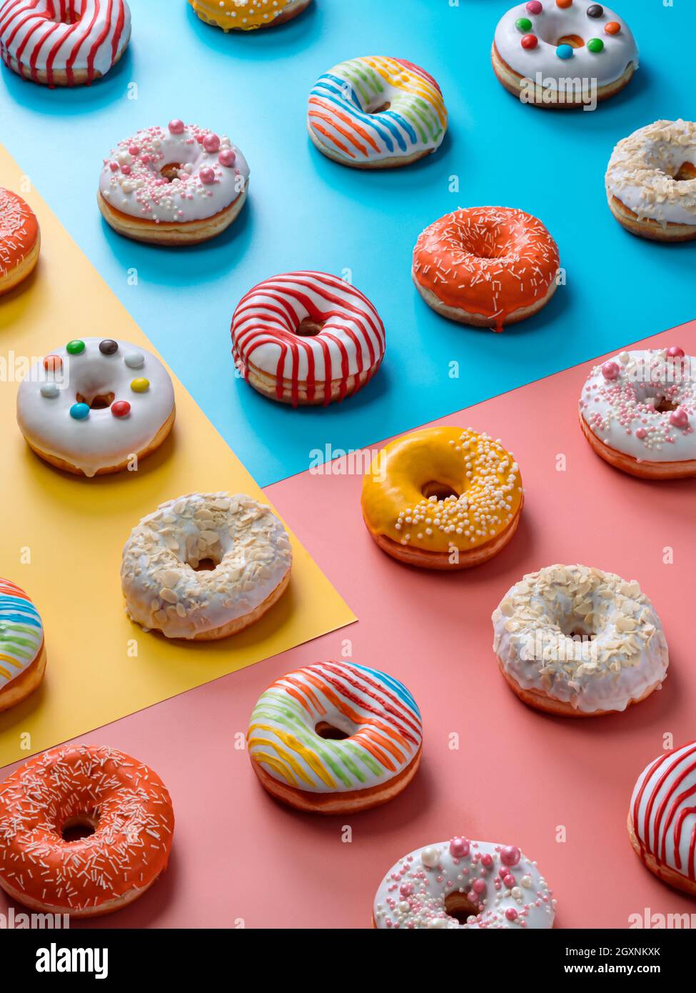 Assorted colorful glazed donuts, perspective view. Creative layout made ...
