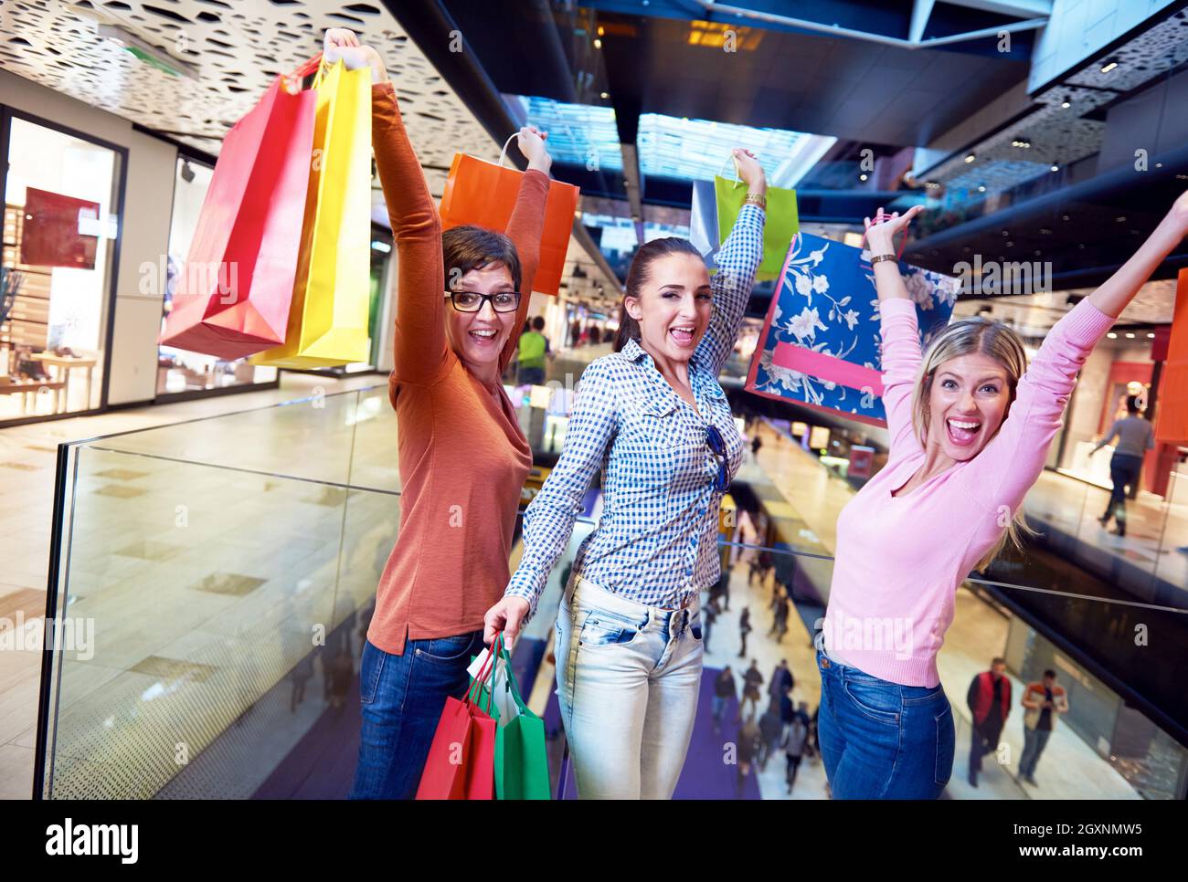 happy young girls in shopping mall, friends having fun together Stock ...