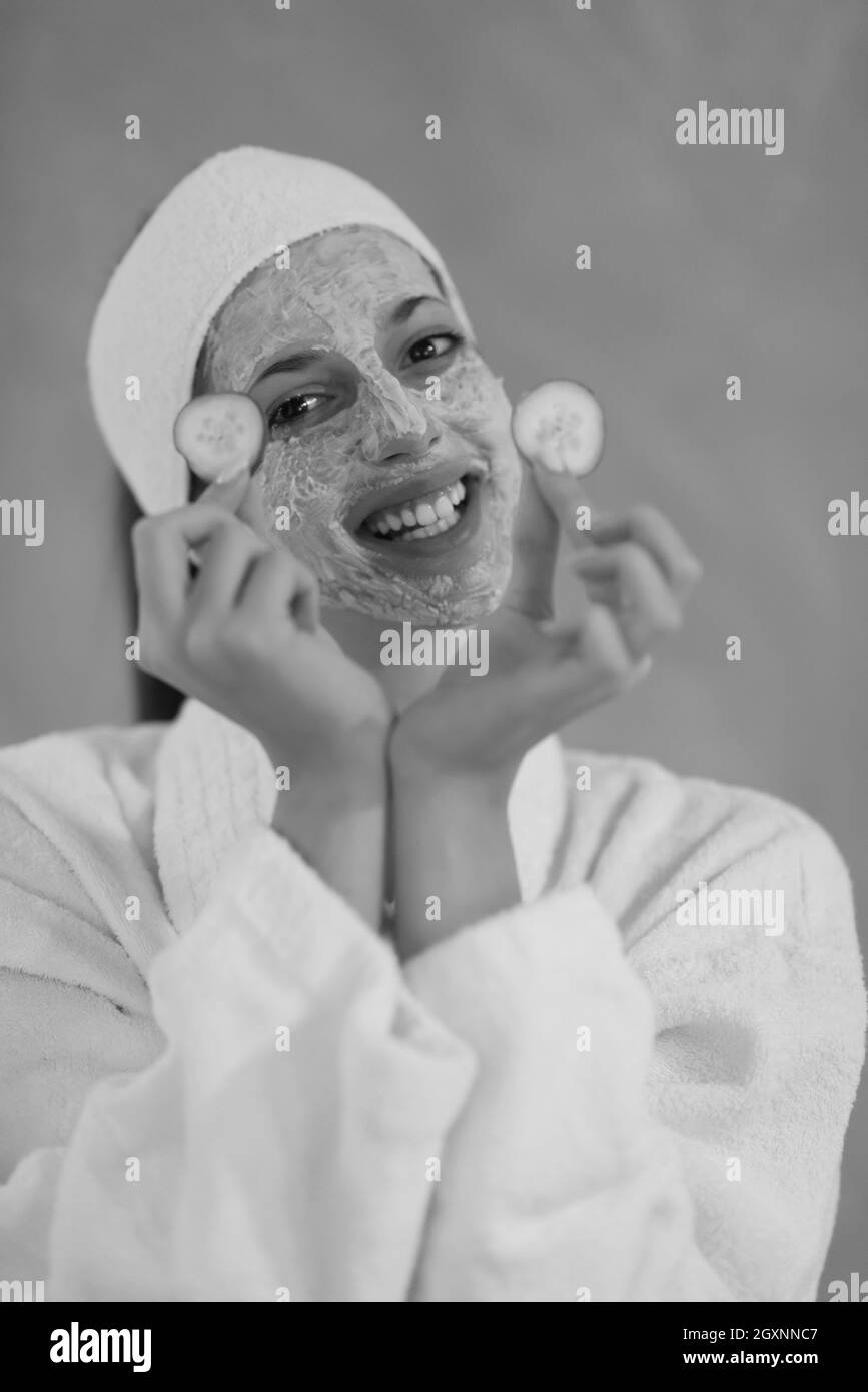 Spa Woman applying Facial Mask Beauty Treatments Close up portrait of ...