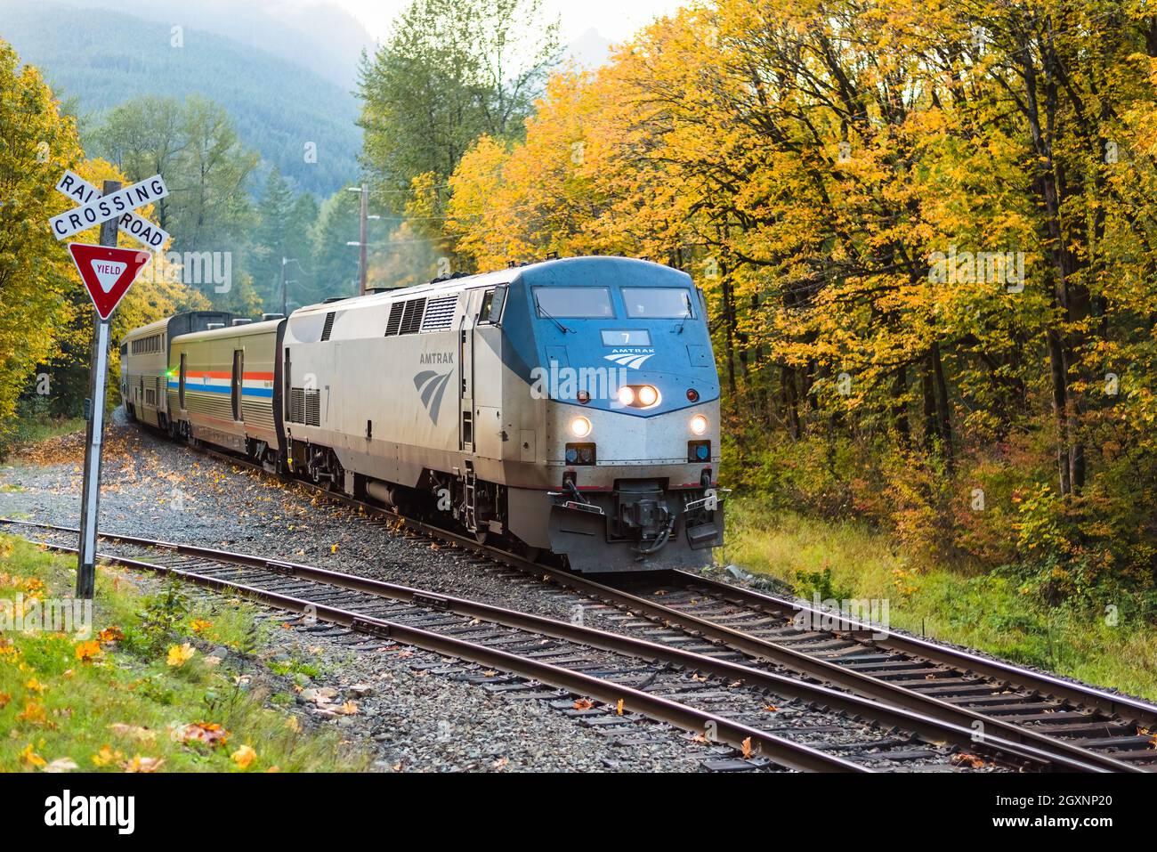 Skykomish, WA, USA - October 01, 2021; An eastbound Amtrak Empire Builder passes through the ...