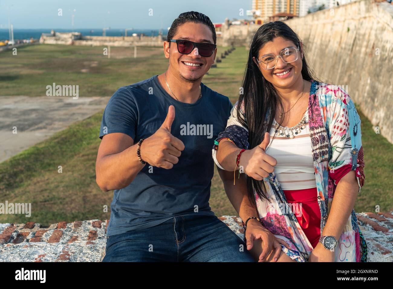 Portrait of Latin Couple looking at camera in the open air Stock Photo ...