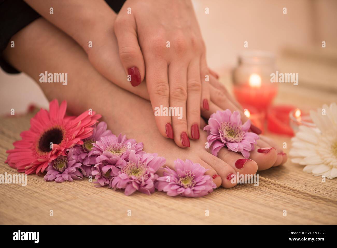 Closeup photo of a female feet and hands at spa salon on pedicure and ...
