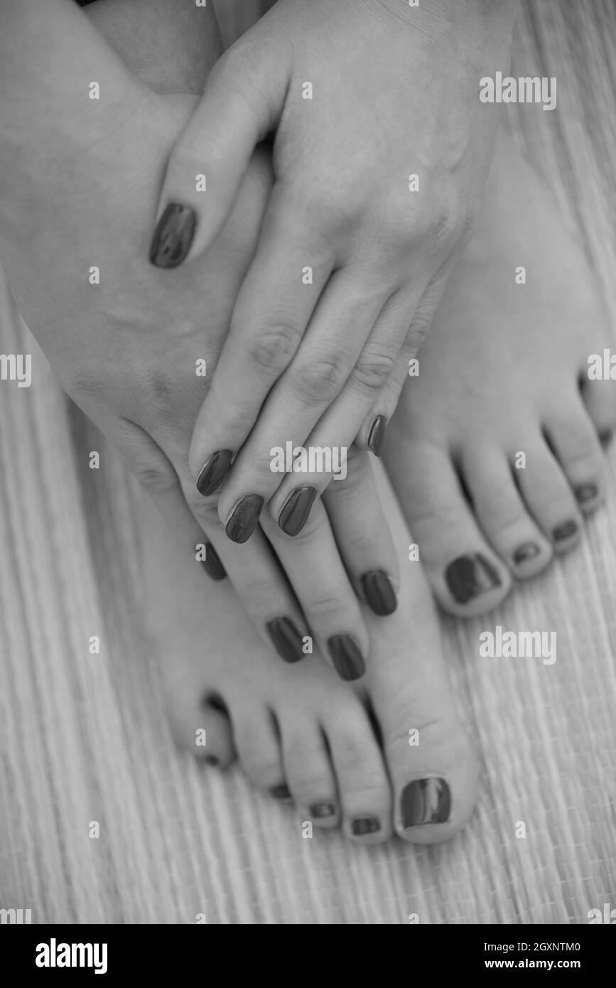 Woman feet hands flower Black and White Stock Photos & Images - Alamy