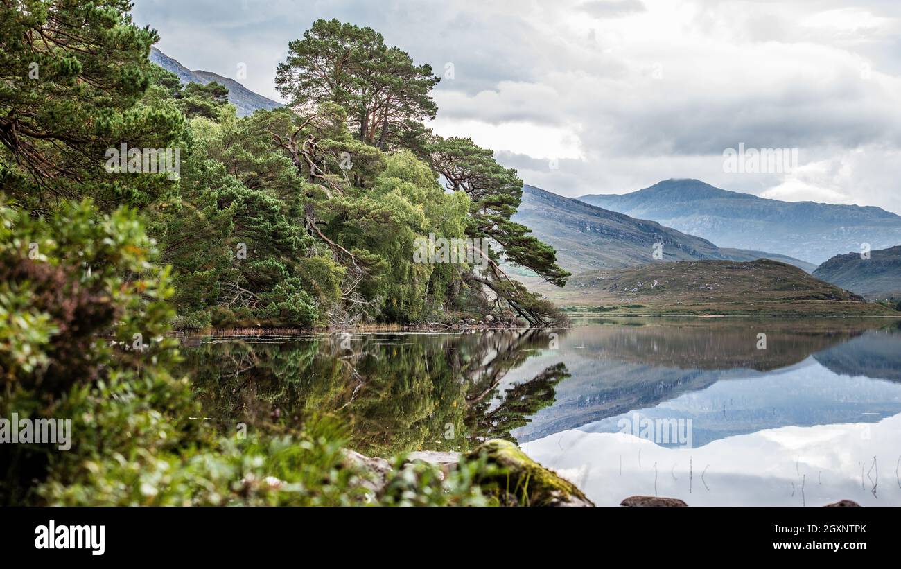 Stunning mirror reflections in Loch Dughail, West coast, Highlands ...