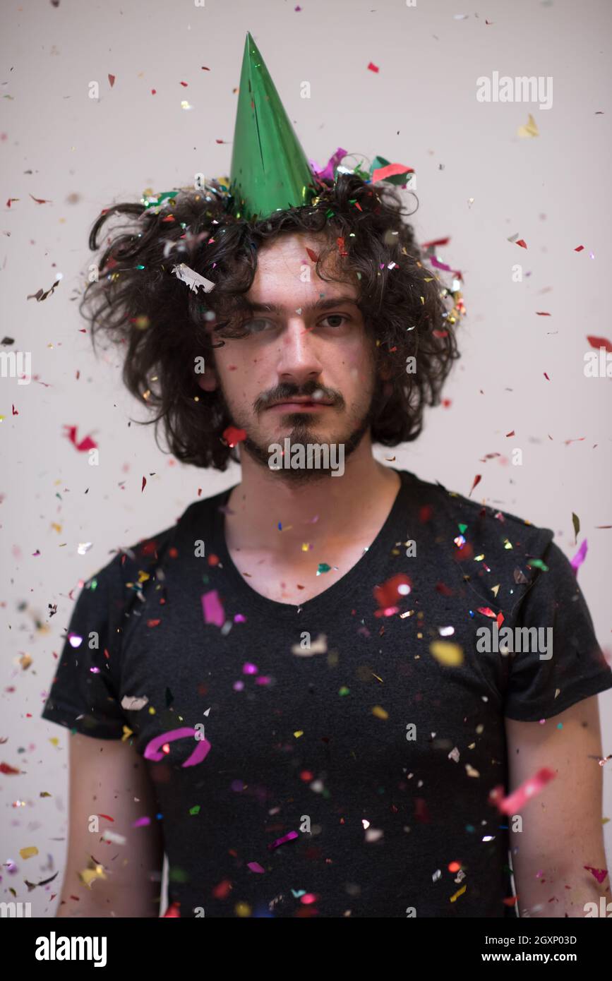 young man on party celebrating new year with falling confetti Stock ...