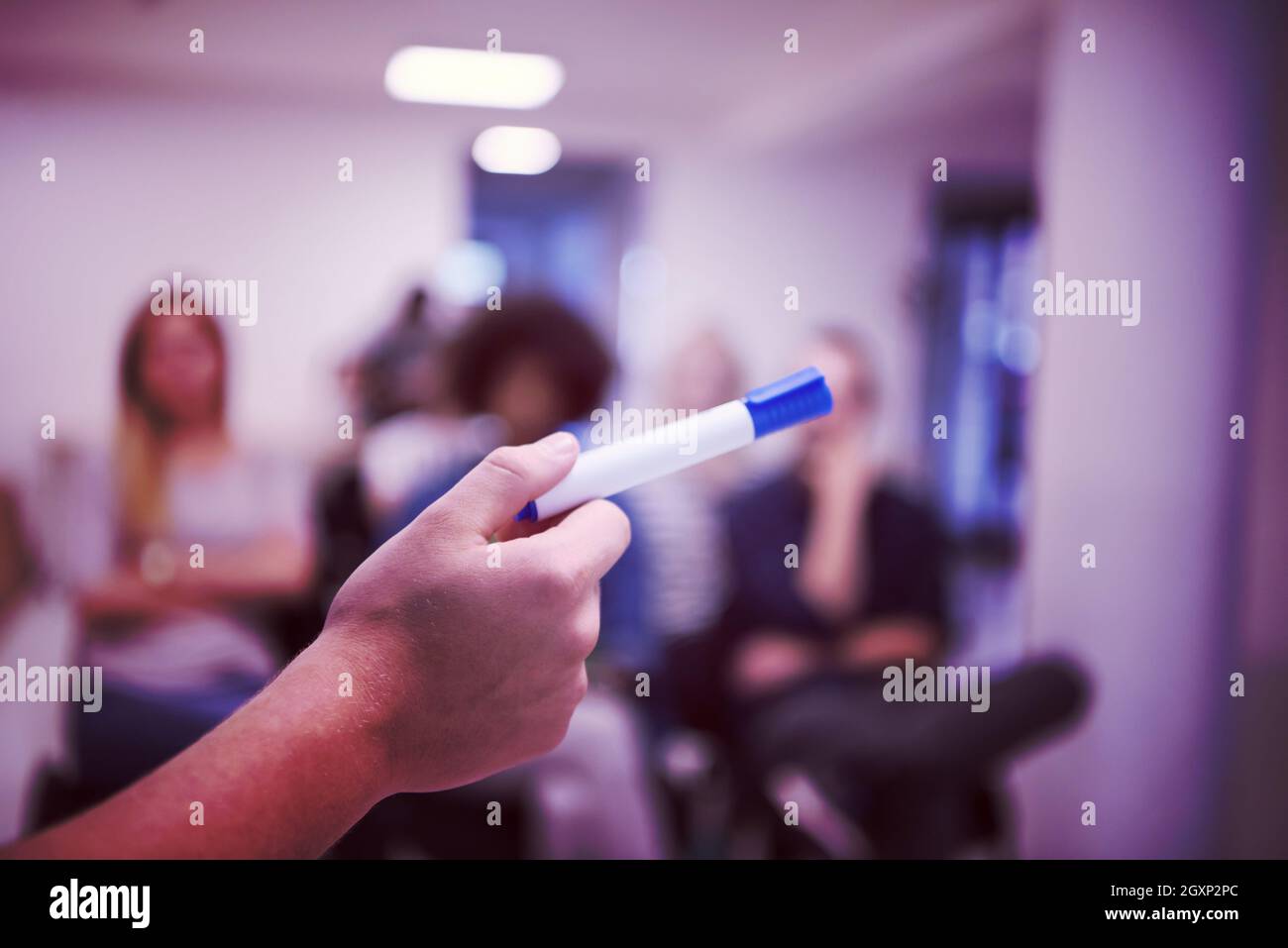 close up of teacher hand with marker while teaching lessons in school ...