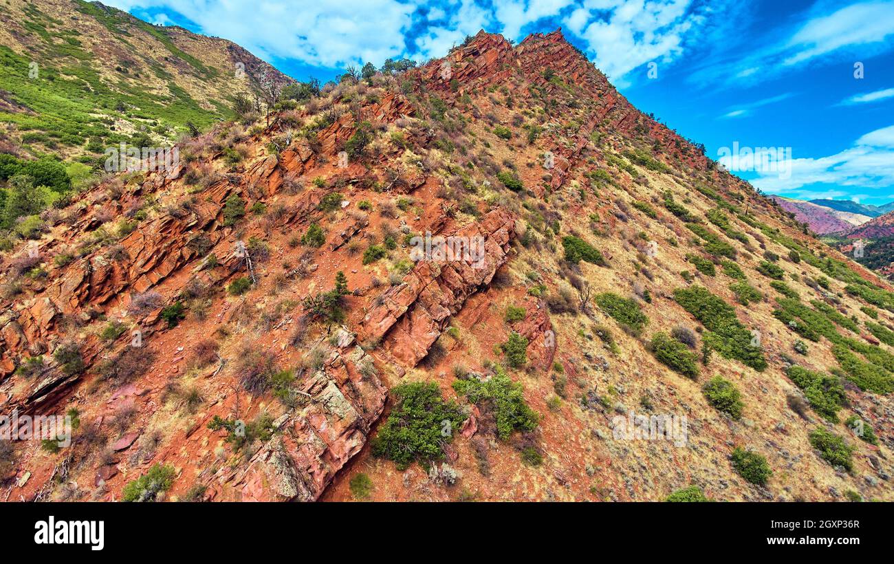 Mountains up close with large red rocks at angle Stock Photo - Alamy