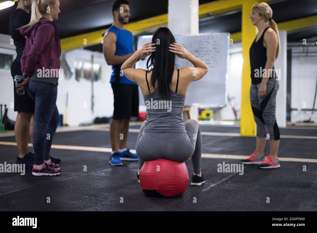 Training course.group of young athletes getting instructions from ...