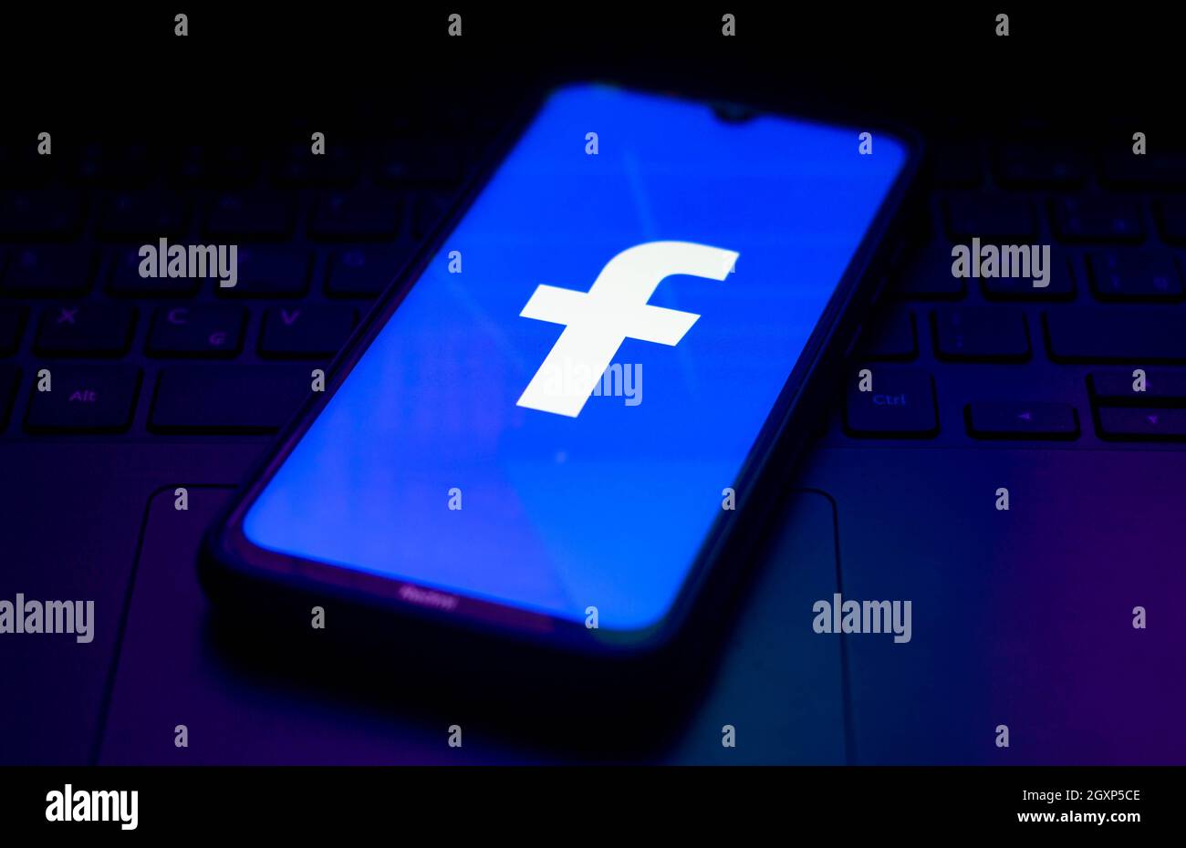 In this photo illustration the Facebook logo seen displayed on a ...