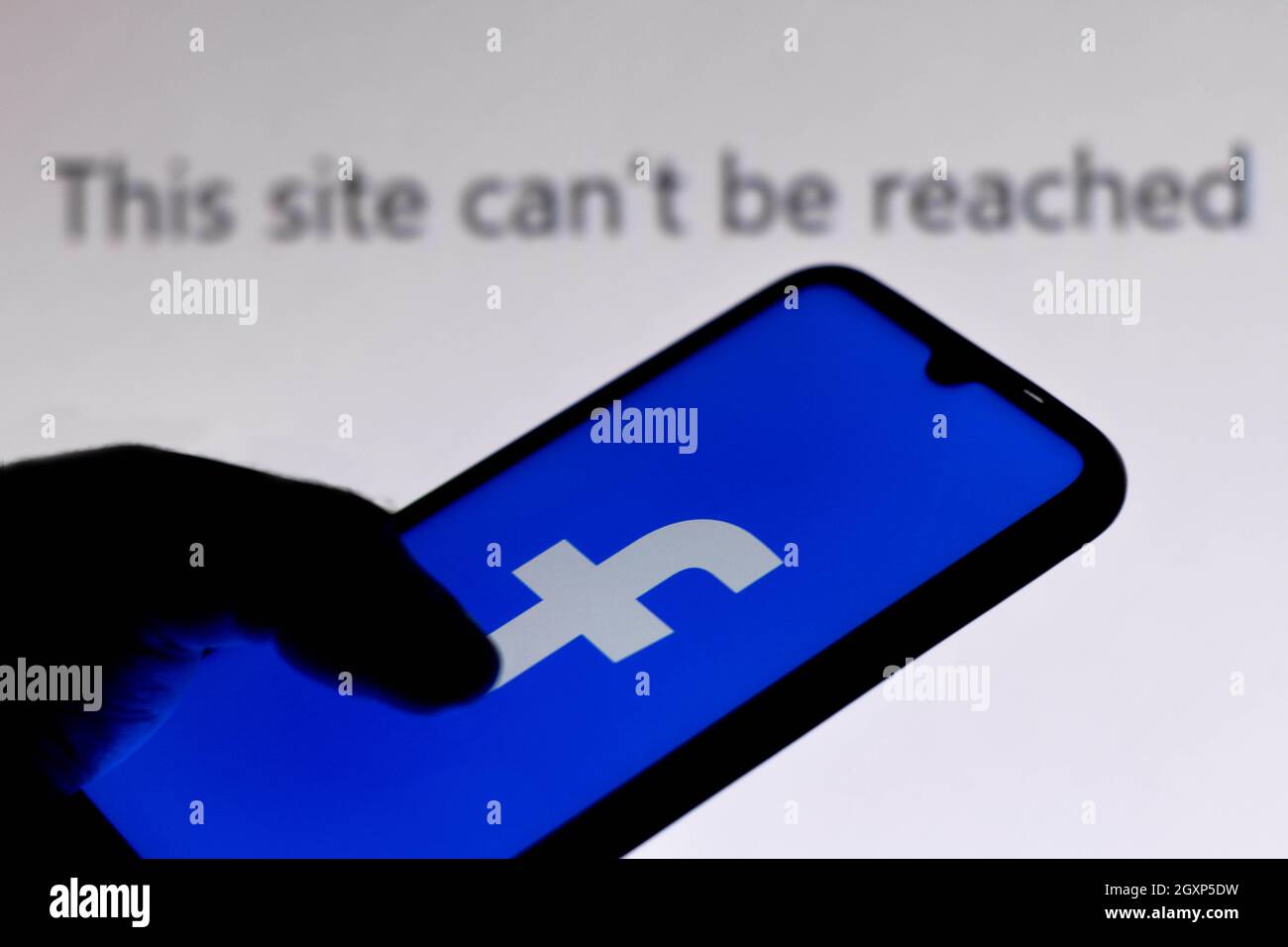 In this photo illustration the Facebook logo seen displayed on a ...