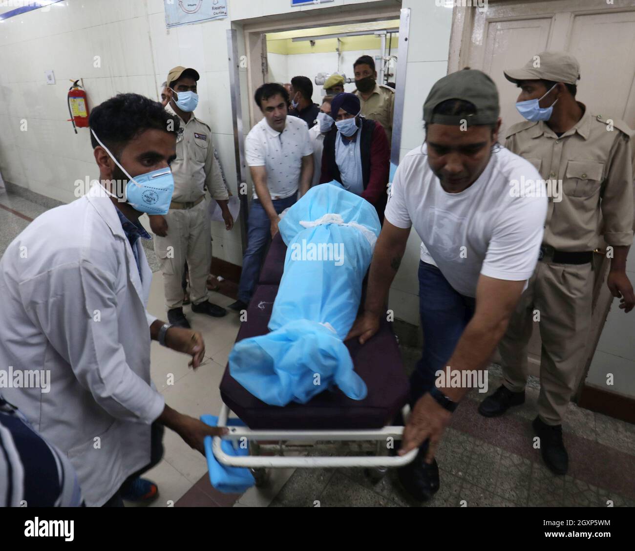 SRINAGAR, INDIA - OCTOBER 5: People carry the dead body of a Makhan Lal ...