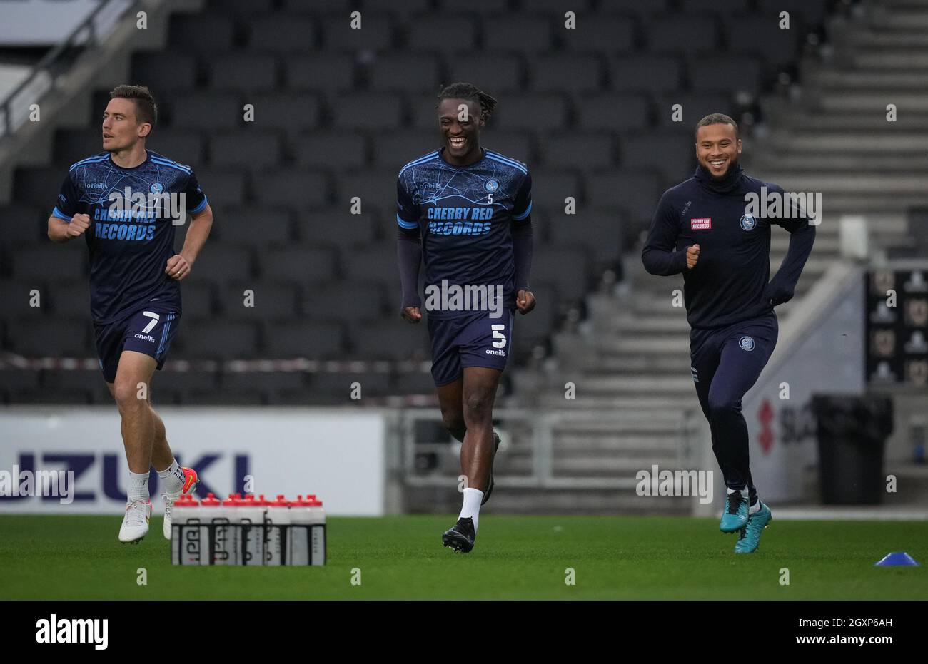 Milton Keynes, UK. 05th Oct, 2021. David Wheeler, Anthony Stewart and Curtis Thompson of Wycombe ...