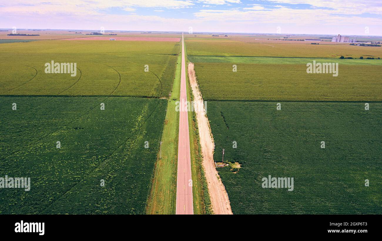 Road through fields of farmland Stock Photo - Alamy
