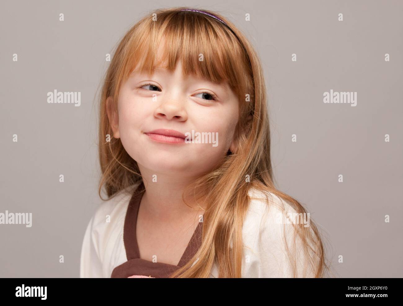 Portrait of an Adorable Red Haired Girl on a Grey Background Stock ...