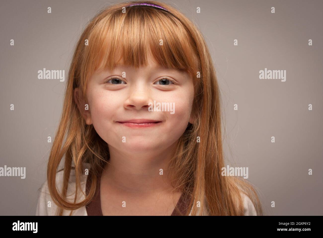 Fun Portrait of an Adorable Red Haired Girl on a Grey Background Stock ...