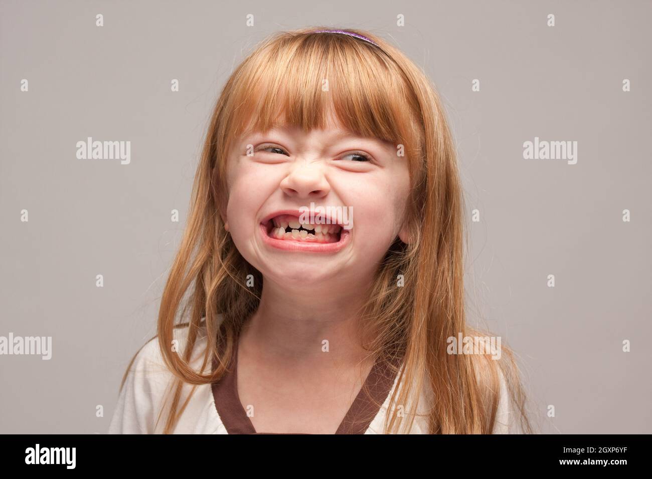 Portrait of an Adorable Red Haired Girl on a Grey Background Stock ...