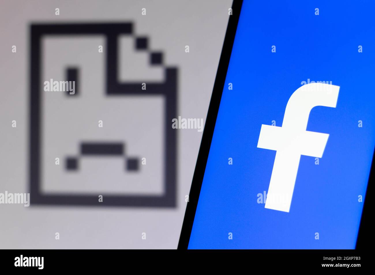 In this photo illustration the Facebook logo seen displayed on a ...