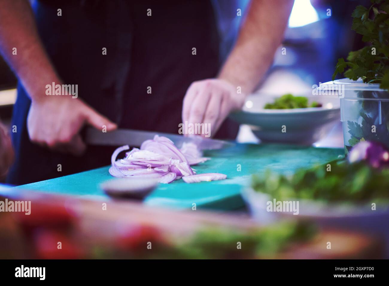 Chef hands cutting the onion with knife . Preparation for cooking ...