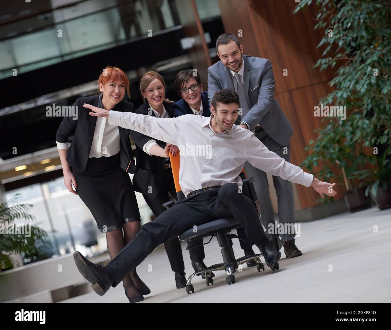 business people group at modern office indoors have fun and push office ...