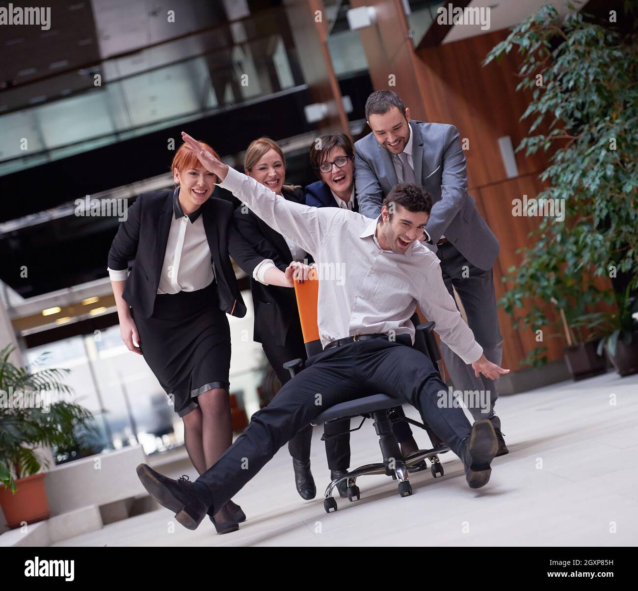 business people group at modern office indoors have fun and push office ...