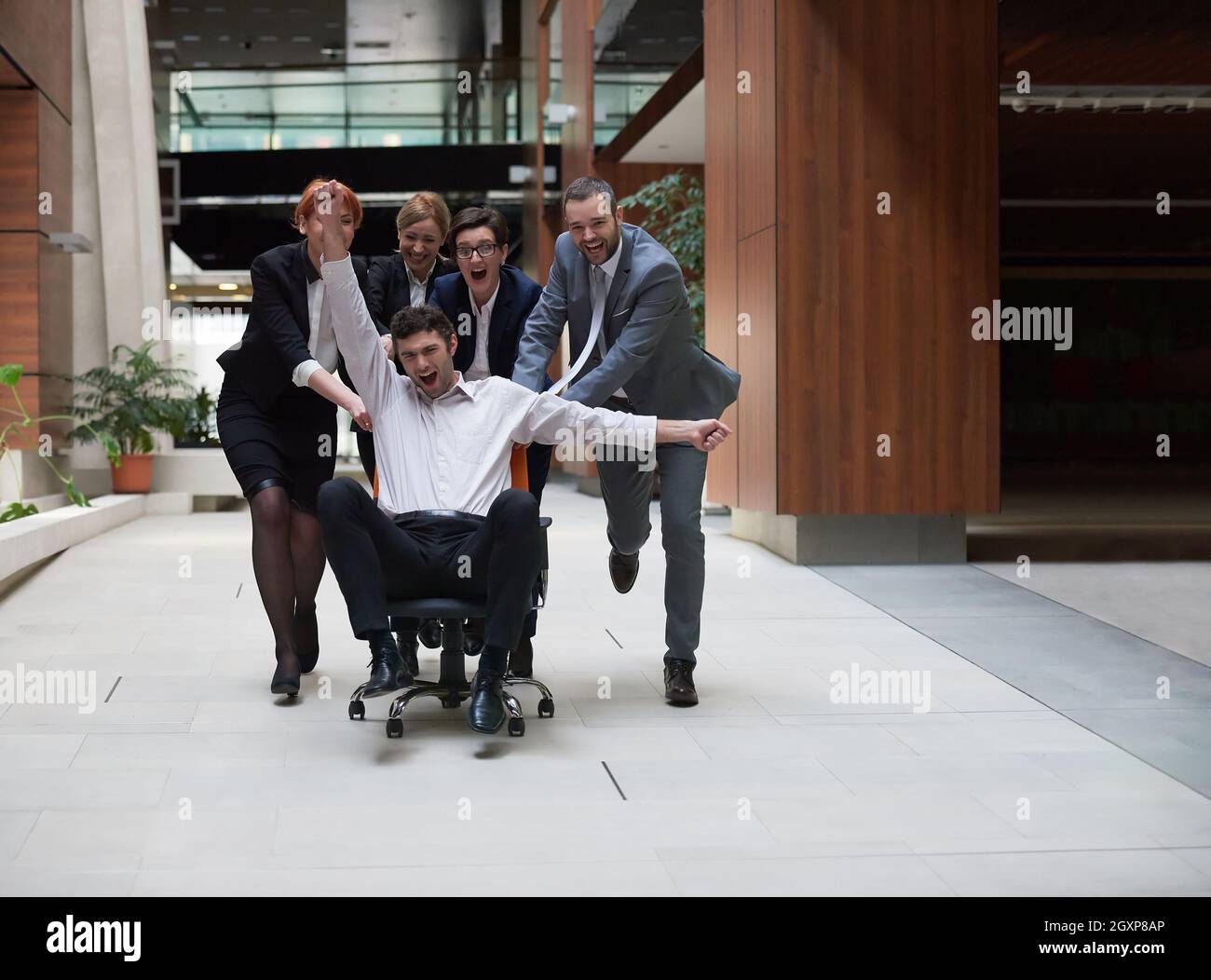 business people group at modern office indoors have fun and push office ...