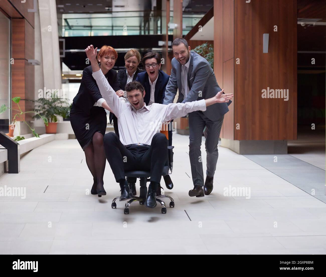 business people group at modern office indoors have fun and push office ...