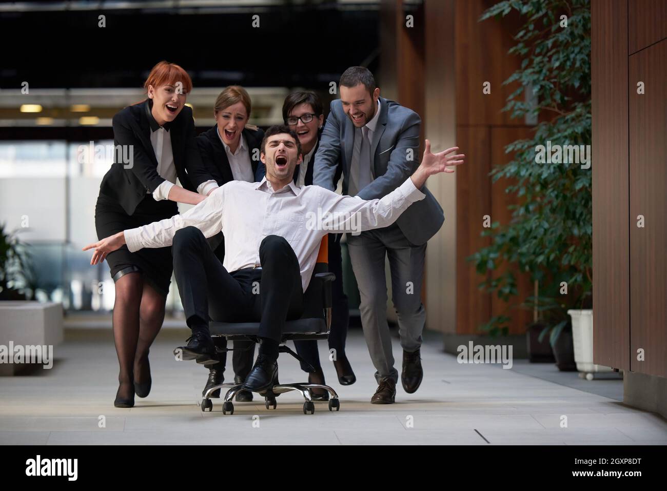 business people group at modern office indoors have fun and push office ...