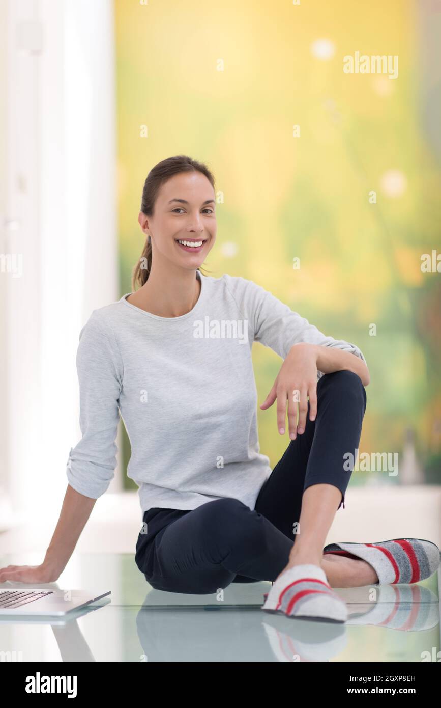 beautiful young women using laptop computer on the floor at home Stock ...