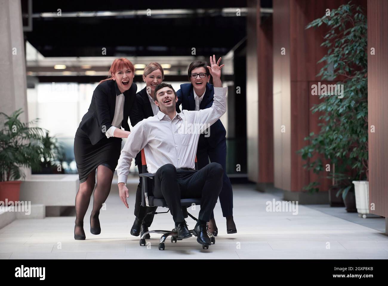 business people group at modern office indoors have fun and push office ...