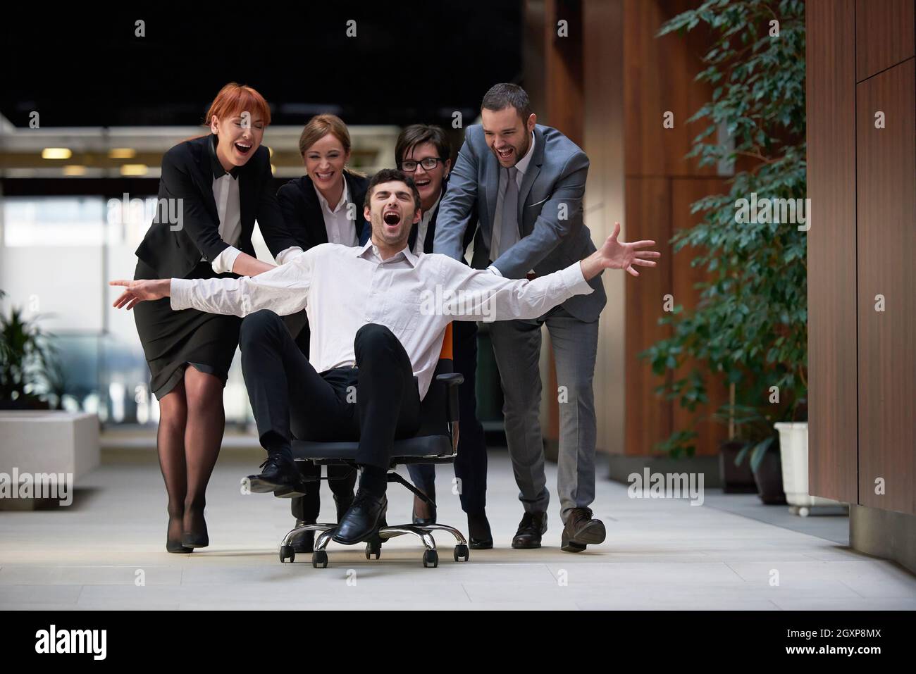 business people group at modern office indoors have fun and push office ...