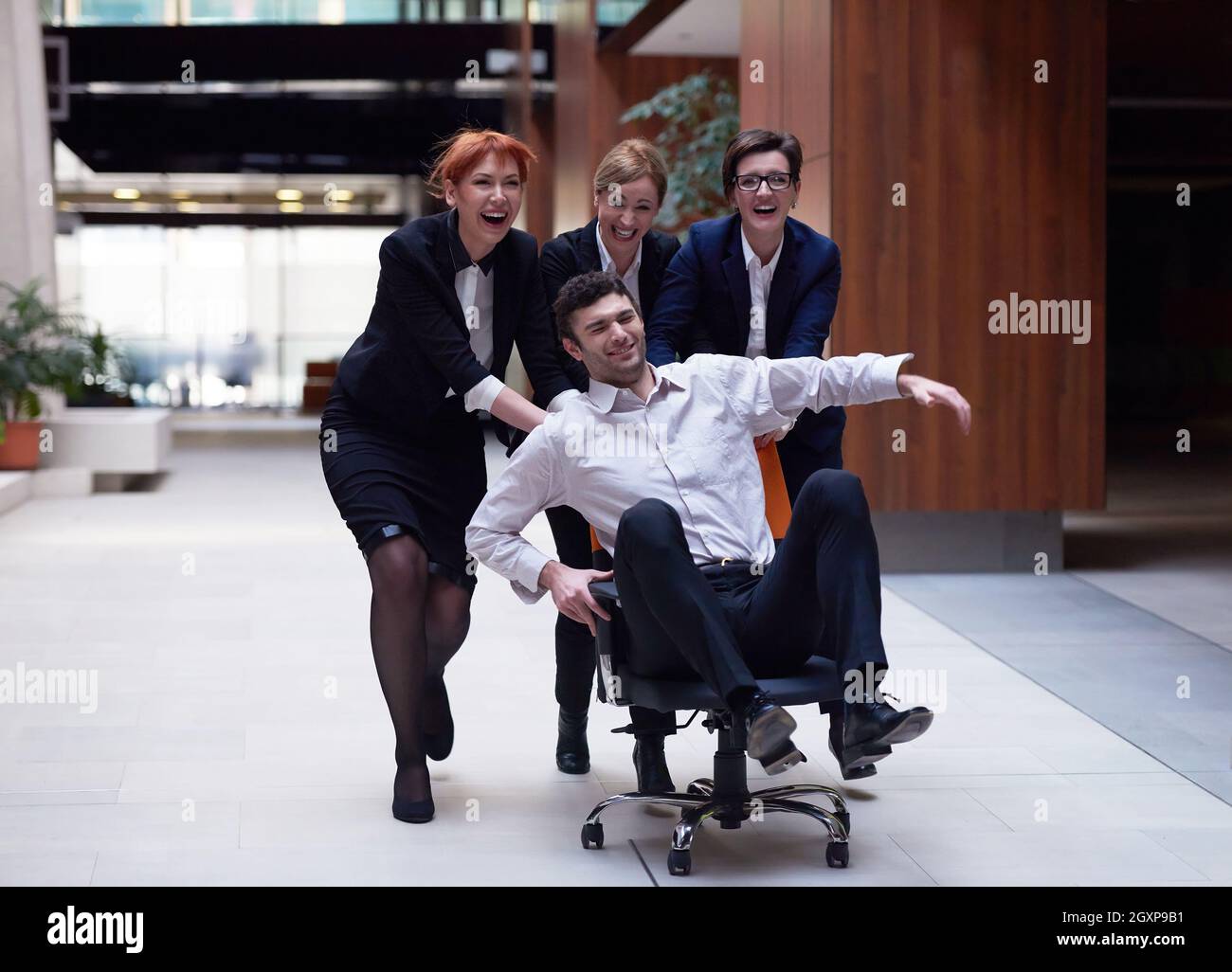 business people group at modern office indoors have fun and push office ...