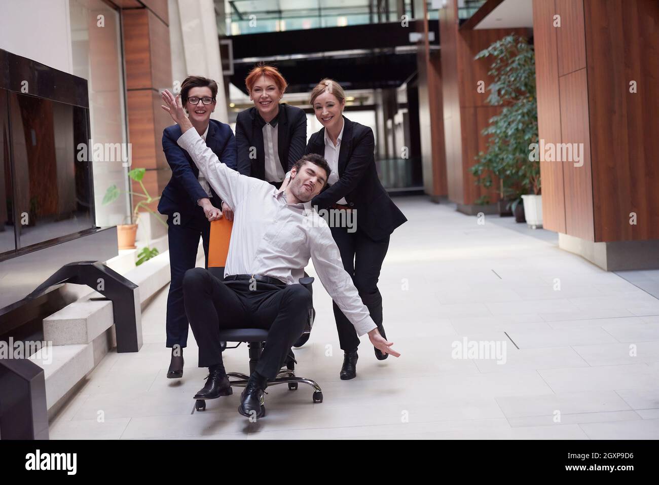 business people group at modern office indoors have fun and push office ...