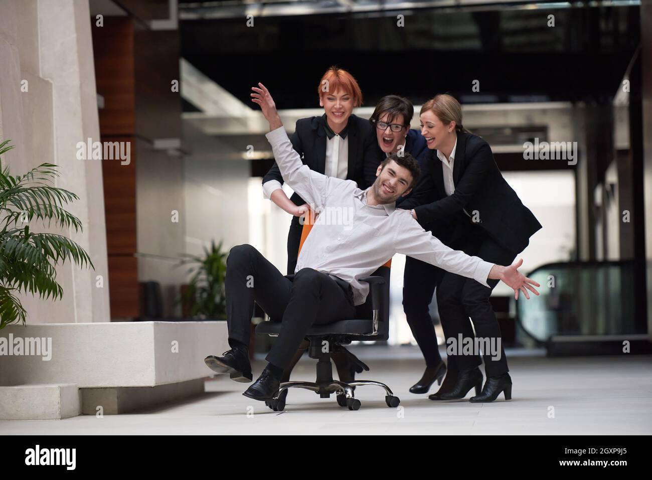 business people group at modern office indoors have fun and push office ...