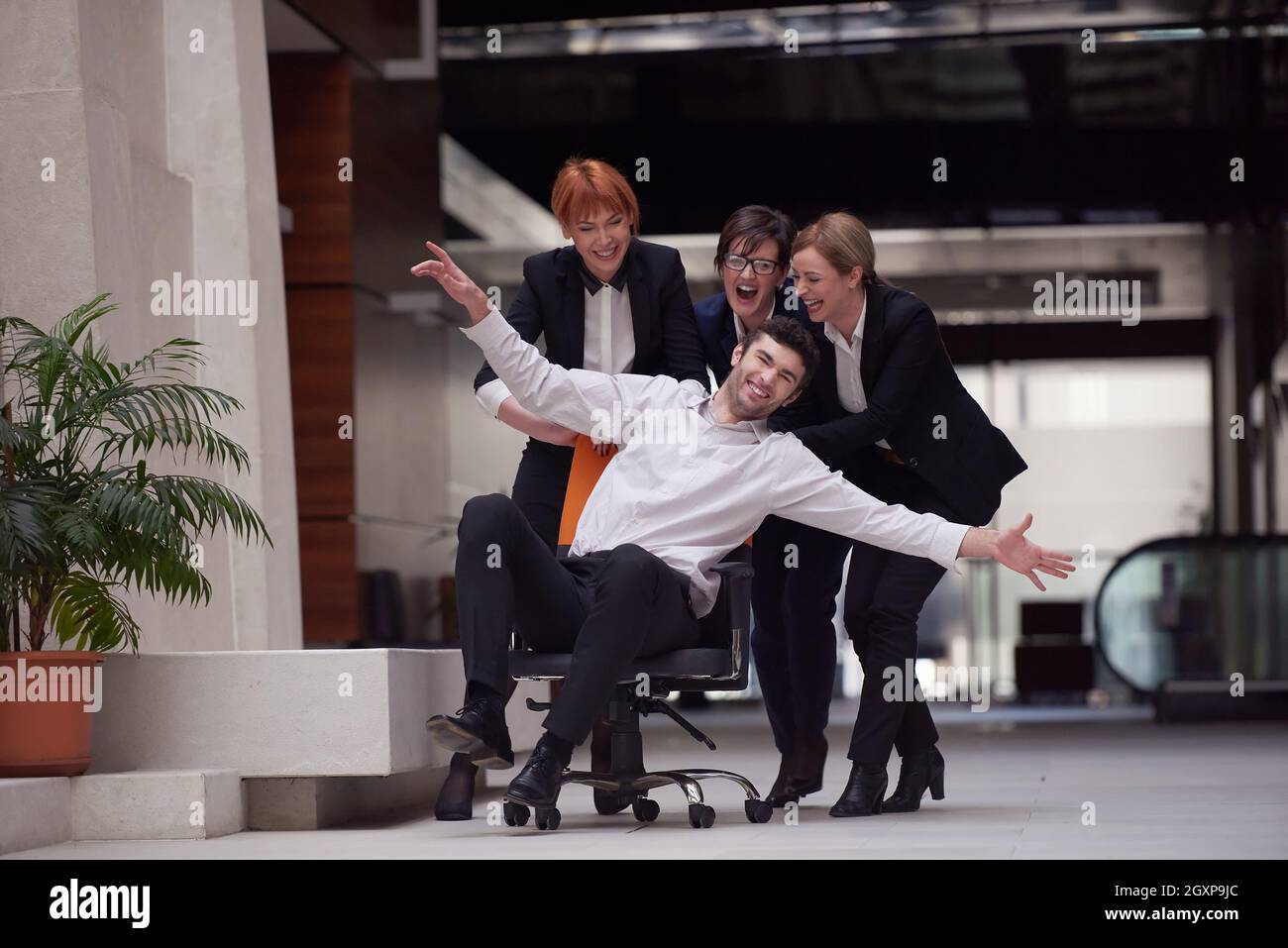 business people group at modern office indoors have fun and push office ...