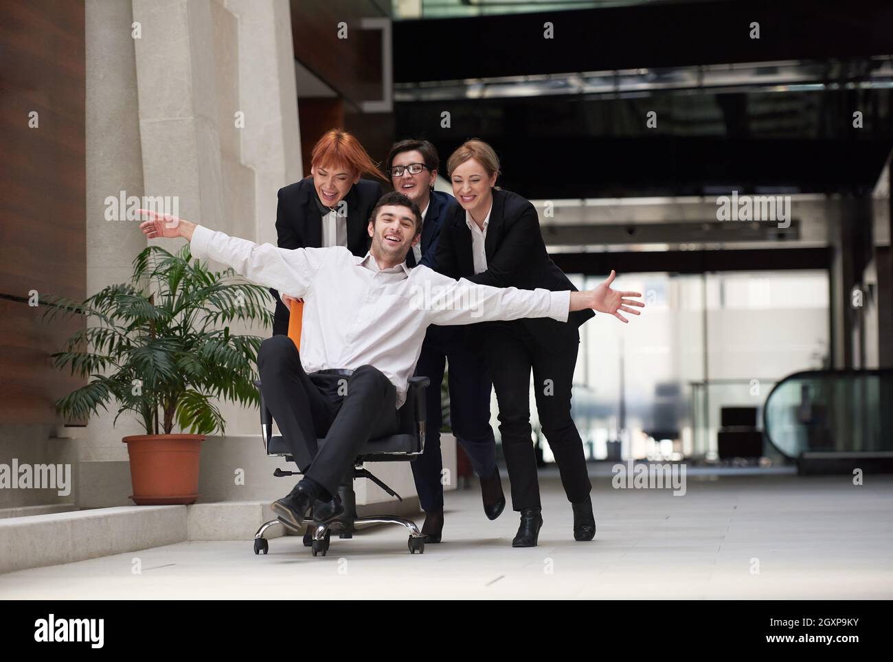 business people group at modern office indoors have fun and push office ...